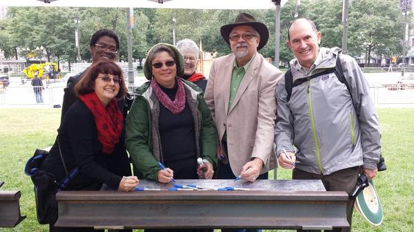 TRU leaders sign M-1 rail - Transportation Riders United