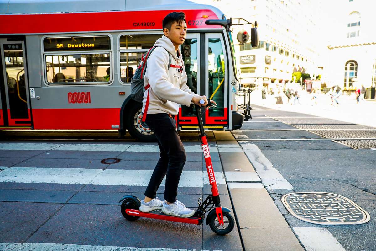 scooter and bus side - Transportation Riders United